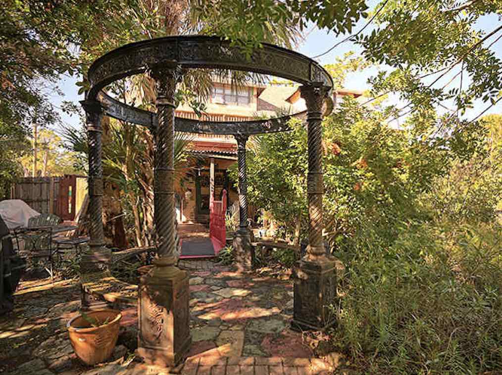 The garden gazebo stands like a philosophical professor among students of nature &ndash; perfect for contemplation or romantic whispers.