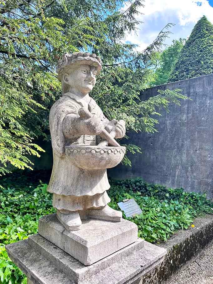 Garden sculpture: This cheerful stone figure has been serving invisible treats to garden visitors for generations. The original food truck!
