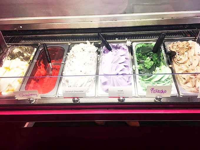 A rainbow of gelato flavors stands at attention – each scoop more vibrant than the last, making American ice cream seem like a pale imitation.