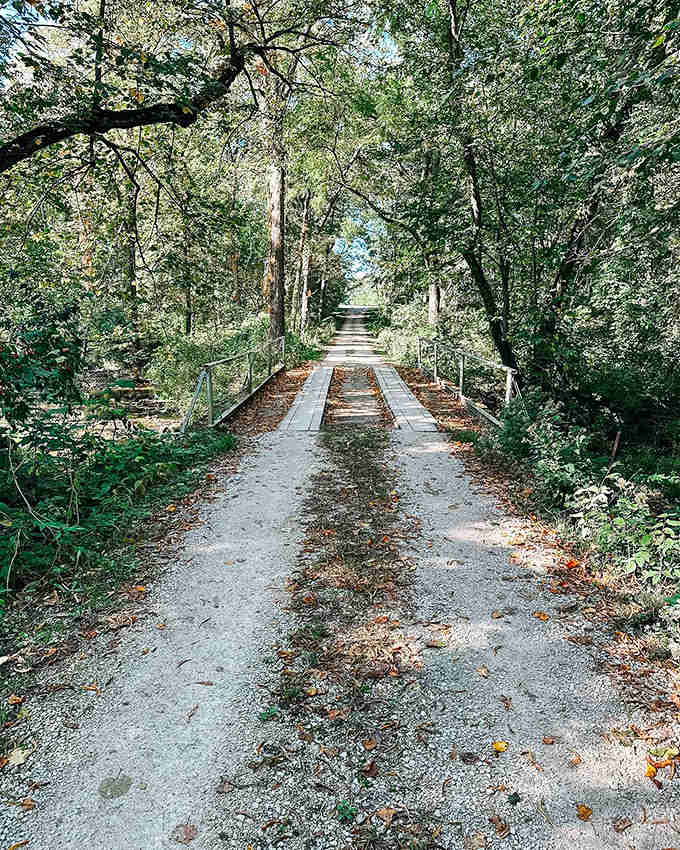 This simple bridge marks the transition between worlds &ndash; from everyday concerns to a space of quiet contemplation and remembrance.