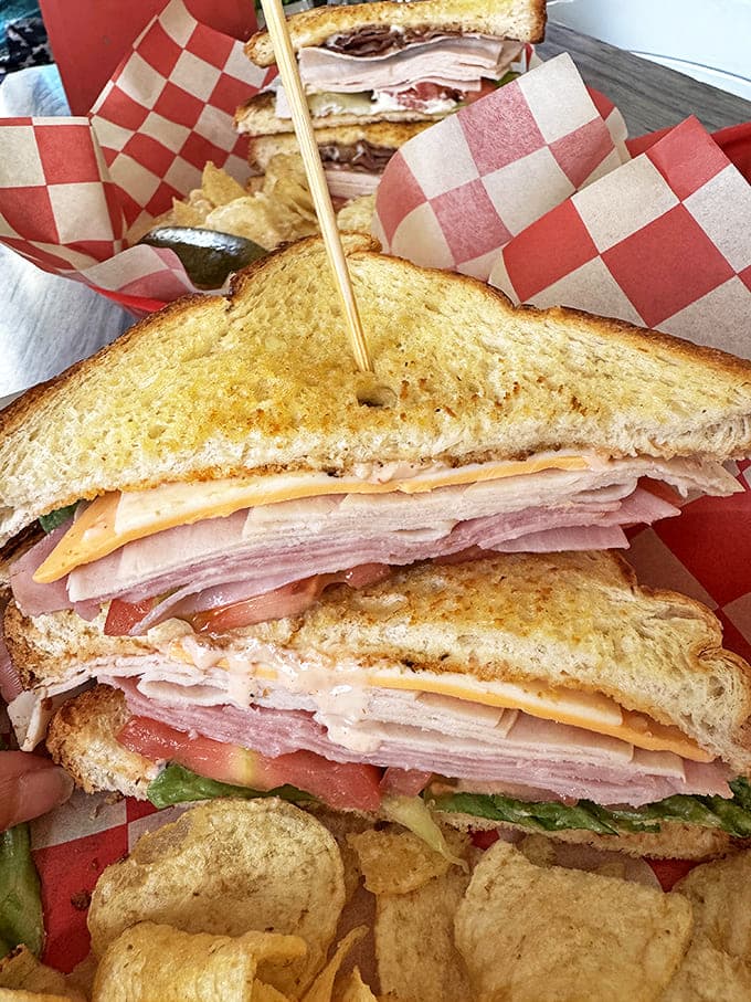 This isn't just a sandwich &ndash; it's a towering achievement of meat, cheese, and vegetables that requires jaw exercises before attempting.