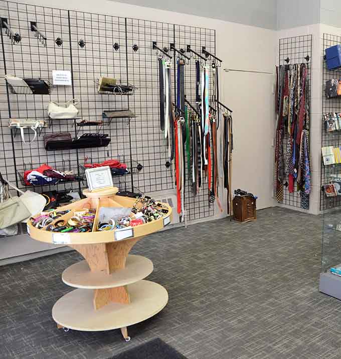 Belts, scarves, and fashion accessories hang ready to transform basic outfits into something special without transforming your bank account into something empty.