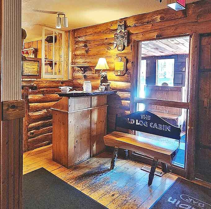 First impressions matter: the log-lined host area welcomes guests with rustic charm that sets the tone for the authentic experience ahead.