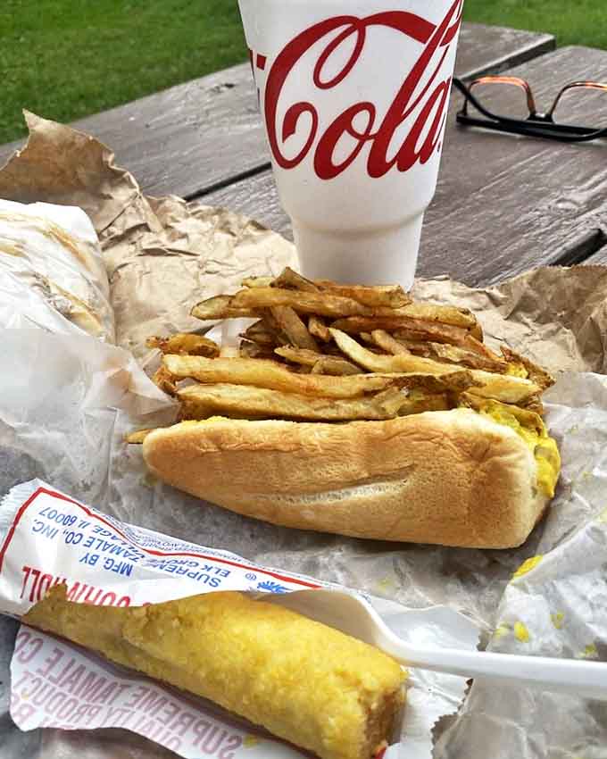 The hot dog and tamale pairing offers textural contrast that would make food scientists weep with joy if they weren't too busy eating.