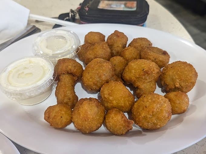 Golden-fried mushrooms arrive hot and crispy, proving that sometimes the best appetizers are the ones that disappear before your main course arrives.