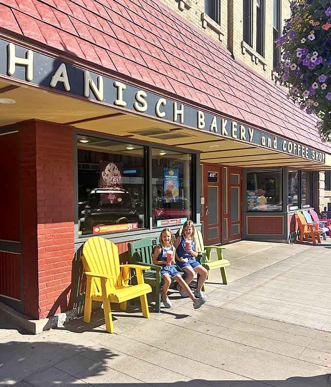 Colorful chairs outside provide the perfect perch for young sugar enthusiasts to contemplate their next sweet adventure.