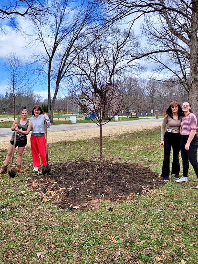 Community tree planting brings residents together, creating living legacies that will shade future generations in this forward-thinking small town.