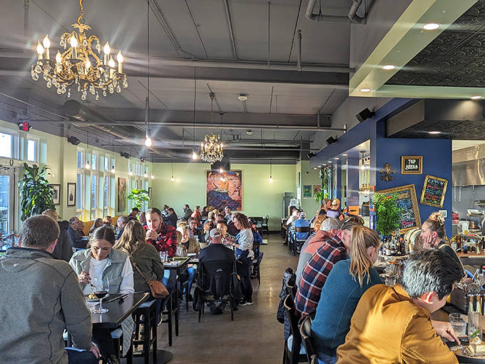Weekend crowds fill the space with laughter and conversation &ndash; the energy is infectious, warm, and undeniably reminiscent of a French Quarter gathering.