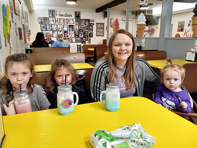 The joy on these faces tells you everything you need to know about Kurly Q, where every visit feels like a celebration worth documenting.