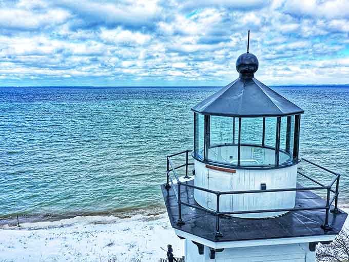 The lantern room's glass panels offer panoramic views of the bay, where on clear days visibility stretches for miles across sparkling waters.