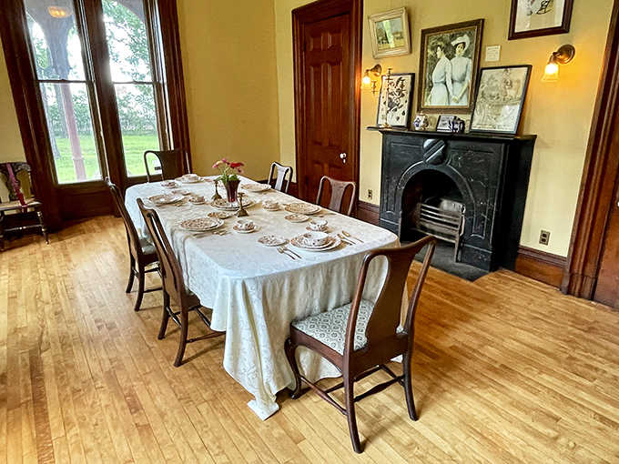 The dining room stands ready for guests who will never arrive, a tableau of Victorian hospitality that makes our paper plates and takeout seem sadly uncivilized.