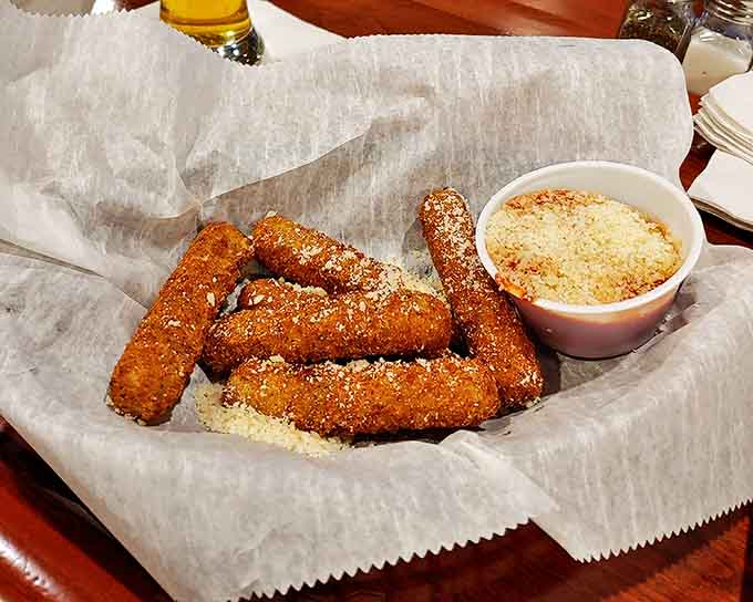 Crispy, golden breadcrumb jackets hide molten cheese treasures within, just waiting for their marinara sauce bath.
