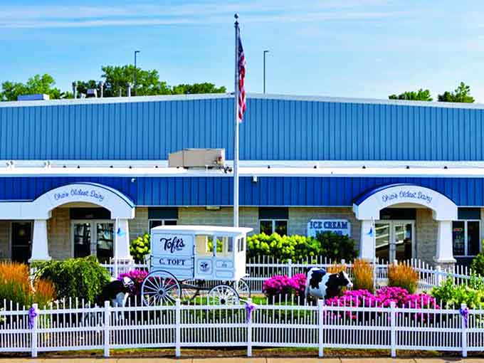 The exterior view showcases Toft's proud presence, complete with white picket fence and decorative cow &ndash; subtle hints at the dairy excellence waiting inside.