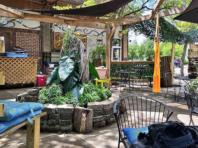 Dappled sunlight filters through the vine-covered pergola, creating a secret garden vibe for those who prefer their breakfast with a side of nature.