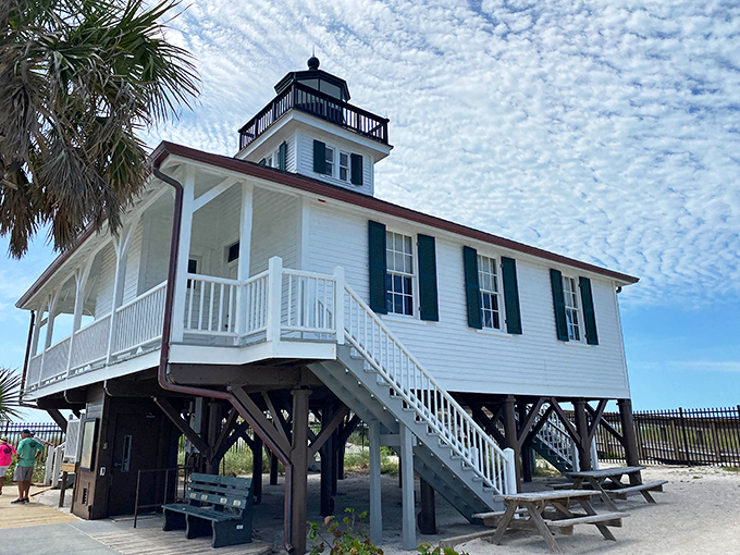 The lighthouse's elevated design isn't just practical—it creates a striking silhouette against the sky, drawing visitors up its welcoming stairs.
