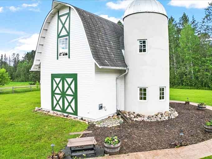 The perfect outdoor gathering spot where Adirondack chairs in cheerful blue invite evening conversations around the fire pit under starry skies.