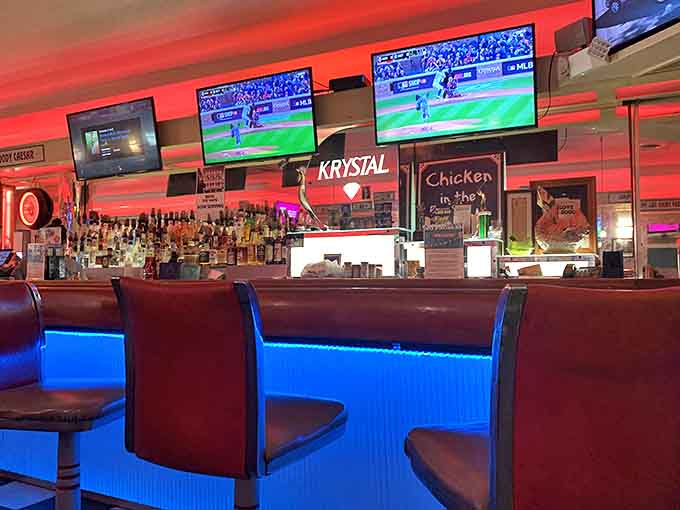 Counter seating illuminated by the glow of multiple TVs &ndash; the perfect perch for solo diners or those seeking prime sports-watching real estate.