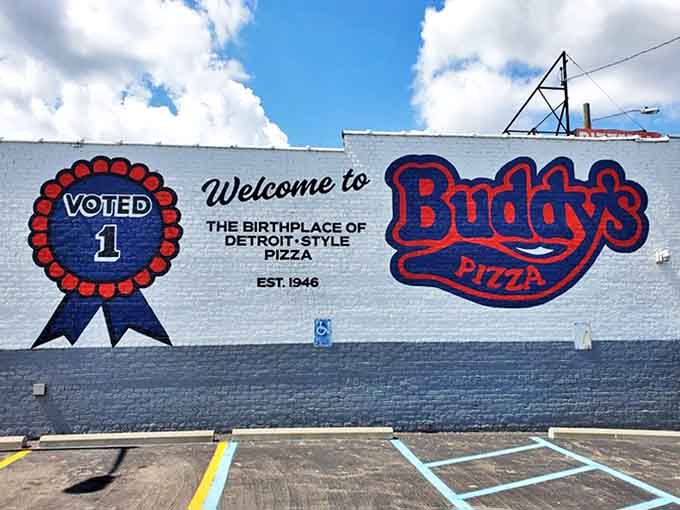 The exterior mural proudly proclaims Buddy's as the birthplace of Detroit-style pizza, a bold claim backed by decades of crispy-cornered evidence.