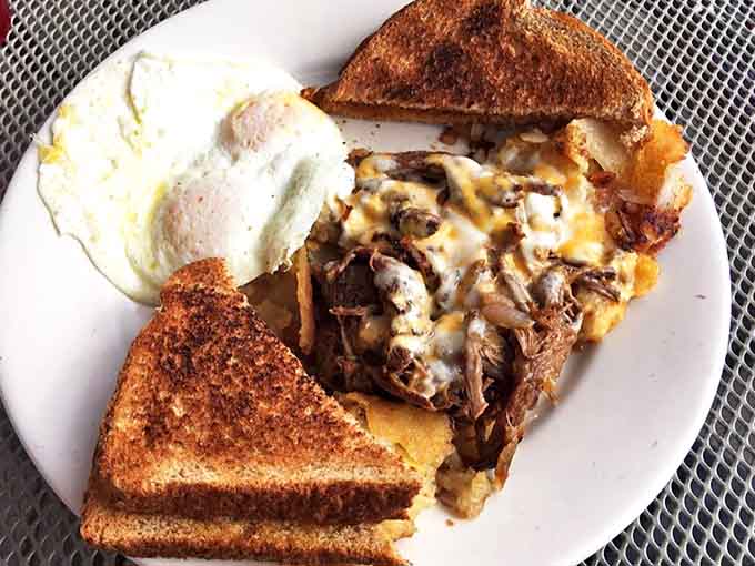 Pot roast hash that makes you want to hug the cook, with eggs sunny-side up bringing morning cheer to this hearty plate.