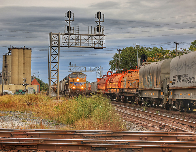 This impressive signal bridge stands sentinel over the tracks, directing the complex dance of steel giants through the junction.