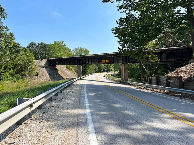 Road Under Bridge: This quiet passage beneath the railroad tracks has likely witnessed generations of Pittsfield residents coming and going, a humble but essential part of local transportation history.