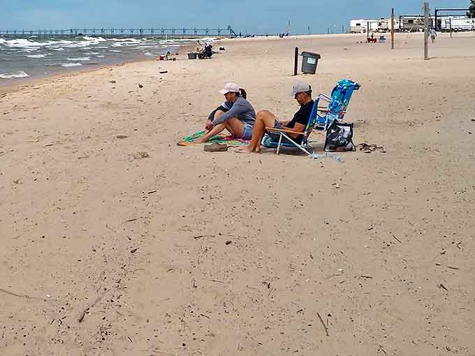 Beach chairs planted in the sand represent the ultimate Grand Haven experience: doing absolutely nothing and loving every minute.