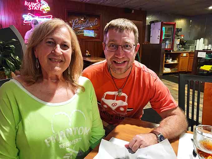 Happy diners enjoying good food and better company perfectly capture what makes Schooners a beloved Bloomington gathering spot.