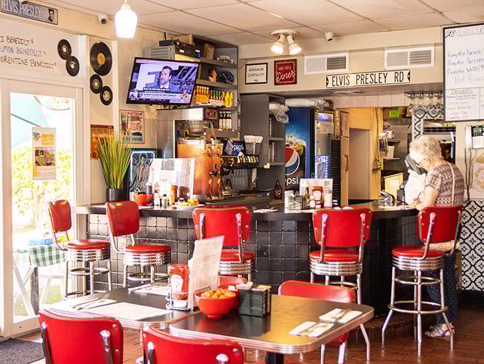 Elvis memorabilia watches over diners like a benevolent king, approving of the comfort food that would have satisfied his famous appetite.