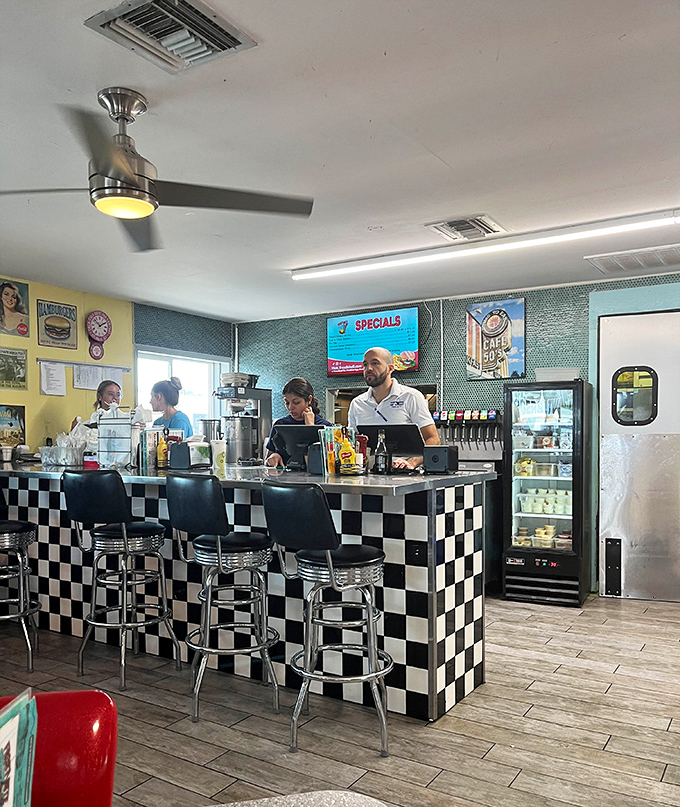 Neon signs glow against vintage-inspired walls, creating that perfect backdrop for ice cream adventures worth documenting.