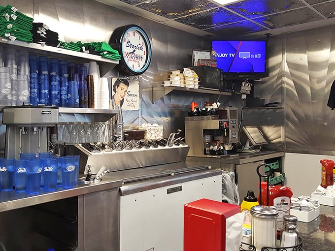 Blue cups stand at attention, ready for thirsty patrons, while the "I love how coffee kicks in" sign speaks truth to caffeine enthusiasts everywhere.