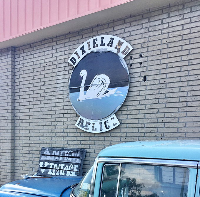 The swan emblem of Dixieland Relics stands guard over this treasure trove &ndash; a fitting symbol for a place where beauty and history converge.