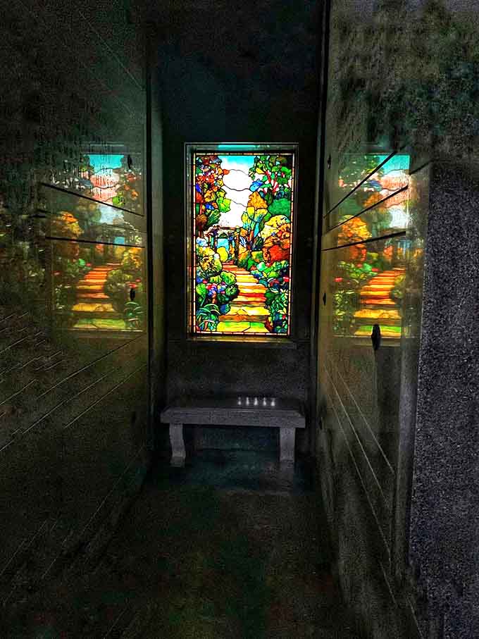 Sunlight transforms this Tiffany-style stained glass into a kaleidoscope of colors, bringing warmth to the cool stone interior.