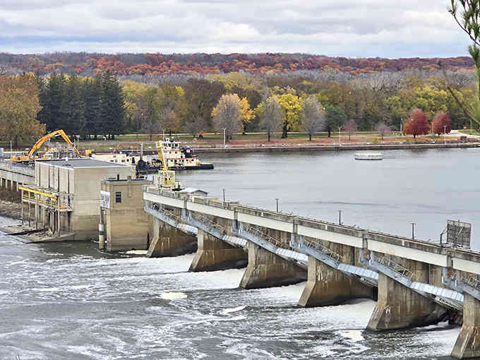 Engineering meets nature at the dam, where rushing water creates a hypnotic soundtrack to the surrounding autumn color show.