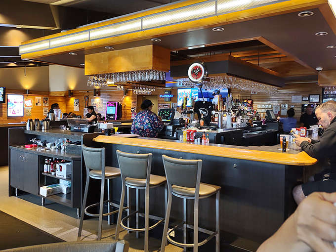 The bar area offers a perfect perch for solo travelers, sports fans, and those who understand that cinnamon rolls pair surprisingly well with local beer.