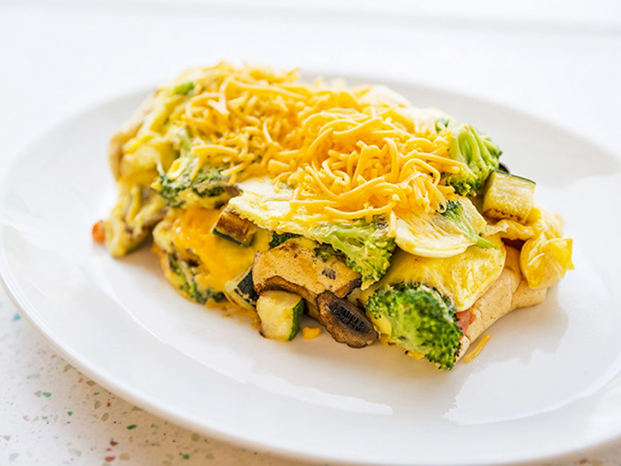 Veggie Omelet: A garden party folded into fluffy eggs &ndash; this vegetable-packed creation proves that healthy choices can still be indulgent breakfast experiences.