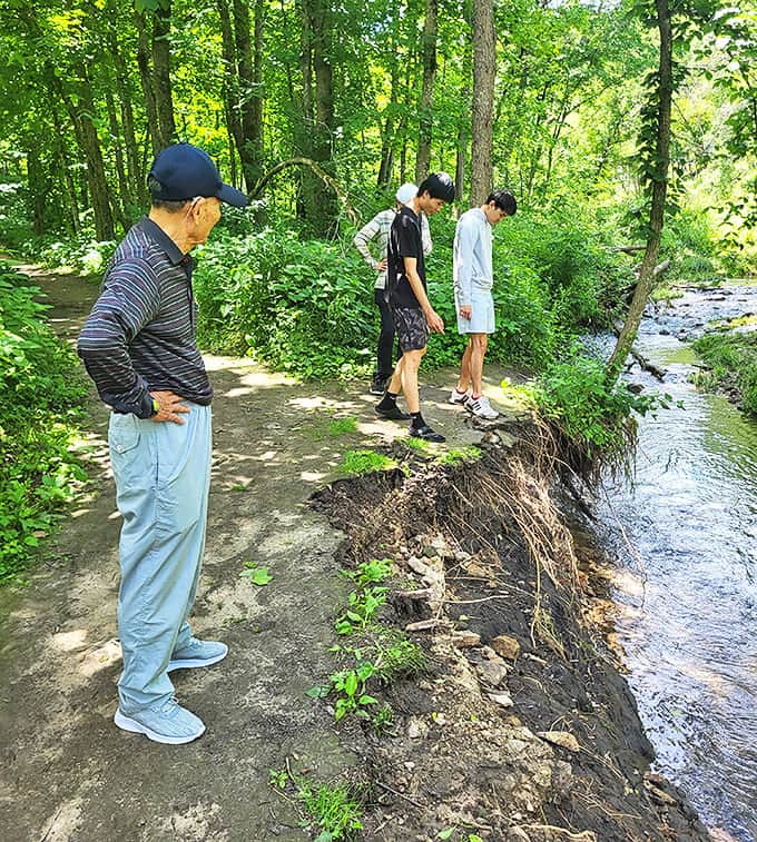 Visitors peer into the Whitewater River, perhaps contemplating a wade or simply mesmerized by water that actually looks clean.