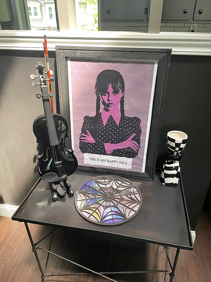 Wednesday Addams would approve of this corner display, complete with her portrait and the perfect deadpan sentiment.