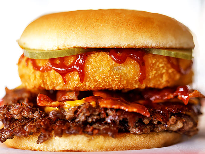 BBQ sauce and onion rings bring rodeo flair to this flavor-packed creation &ndash; like the Wild West in burger form, minus the tumbleweeds.