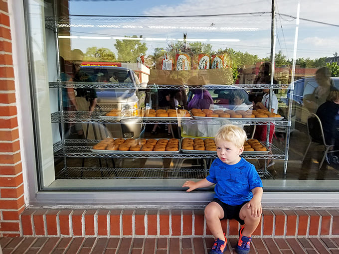 Kid in donut heaven: The face of pure contemplation&mdash;a young connoisseur considering life's most important question: which donut to choose?