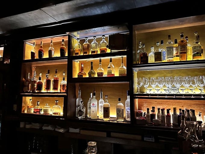 The bar's illuminated shelves showcase spirits like museum pieces &ndash; liquid art waiting to be transformed into your evening's perfect companion.