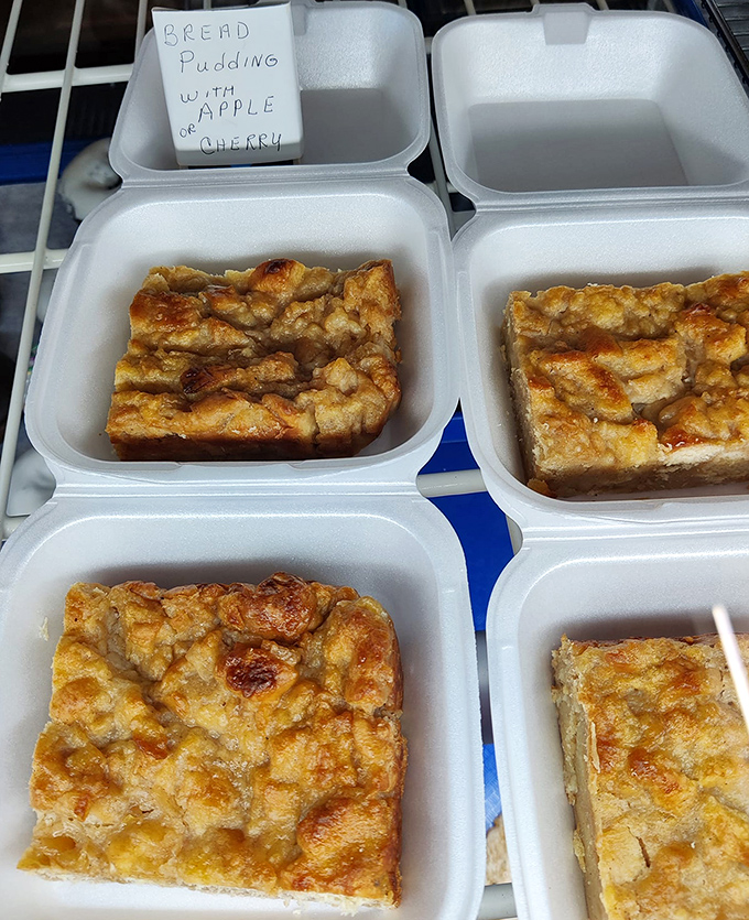 Bread pudding that transforms yesterday's bread into today's treasure – available with apple or cherry for your fruity pleasure.