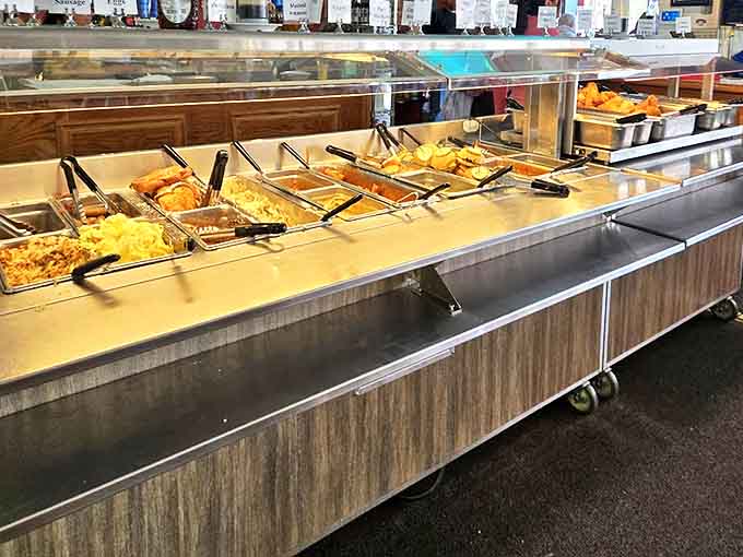 The buffet line showcases golden-fried treasures waiting to be claimed &ndash; a parade of comfort food classics kept warm and ready.