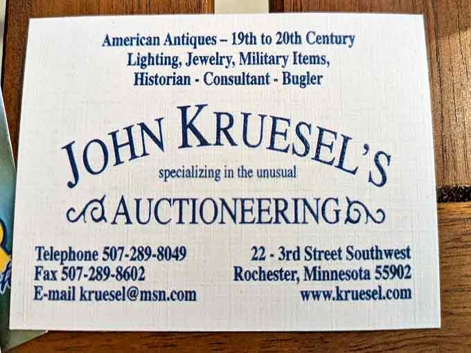 The business card identifies the proprietor not just as an auctioneer but also as a "historian," "consultant," and intriguingly, a "bugler."