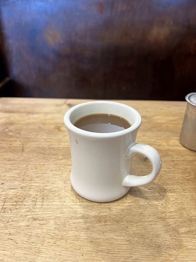 The humble coffee mug – thick-walled, no-nonsense, and containing the lifeblood that powers small-town America through each day.