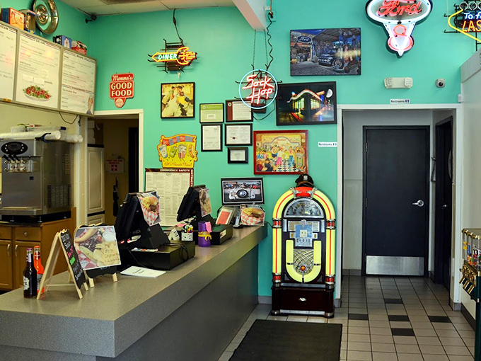 The jukebox, vintage signs, and soda fountain counter create a corner of the diner where time stands still and every day feels like Saturday.