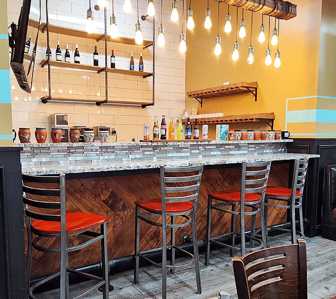 The bar area: where coffee magic happens and friendly conversations flow as freely as the refills.