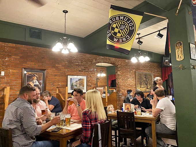The dining room buzzes with energy as guests enjoy authentic German cuisine in a space where conversations flow as freely as the beer.