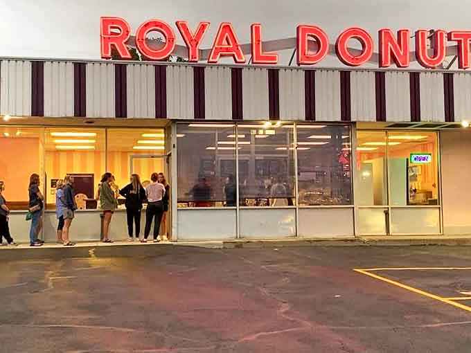 The evening line stretching outside proves some traditions are worth waiting for, especially when warm donuts are the reward.