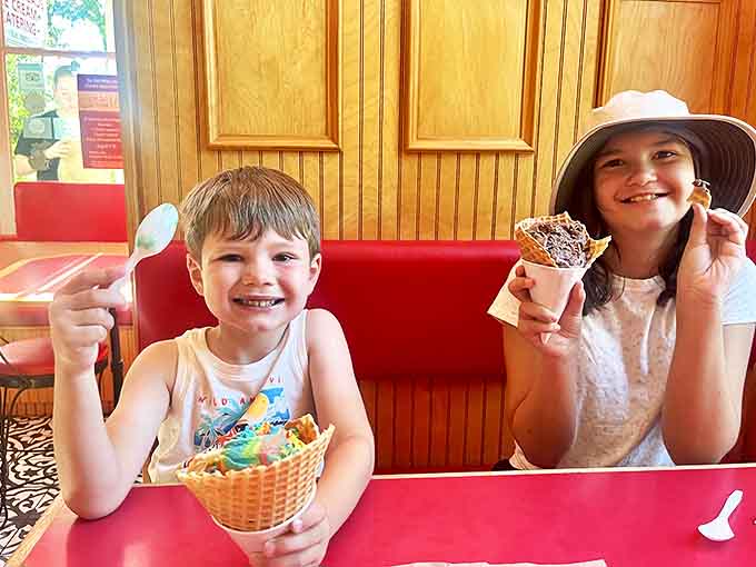 Happy diners experiencing that universal moment of ice cream joy&mdash;when the first bite hits and everything else in the world momentarily fades away.