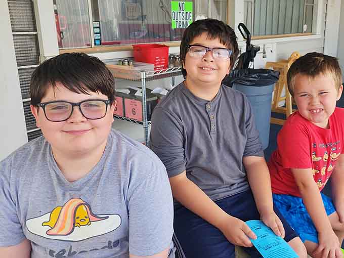 The outdoor dining area becomes a community gathering spot where conversations flow as freely as the root beer on warm Michigan days.
